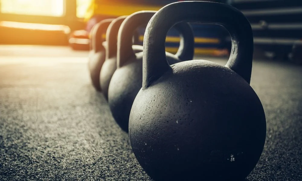 What are the benefits of using iron for gym weights and equipment?